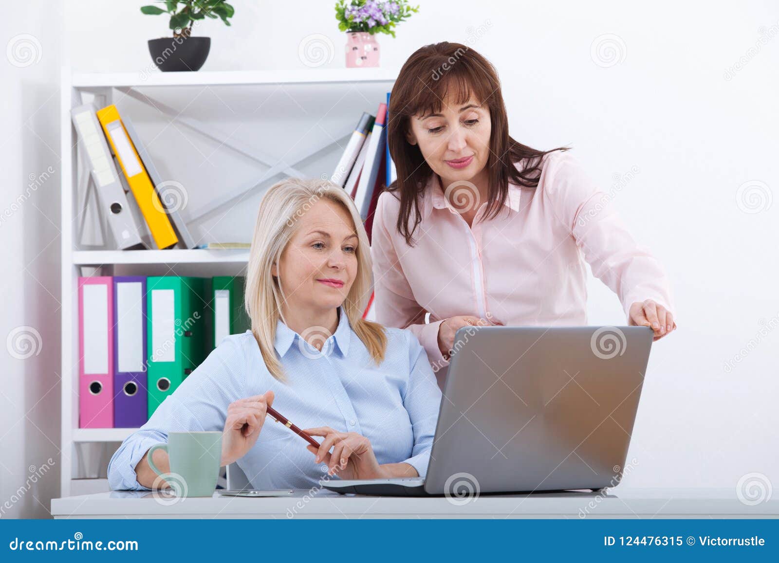 Two Managers Working on Laptop in Office. Stock Image - Image of ...
