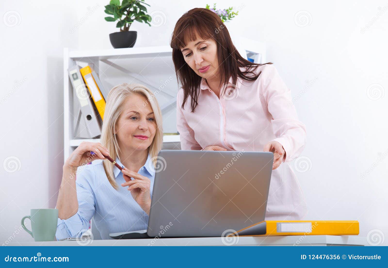 Two Managers Working on Laptop in Office. Stock Photo - Image of ...