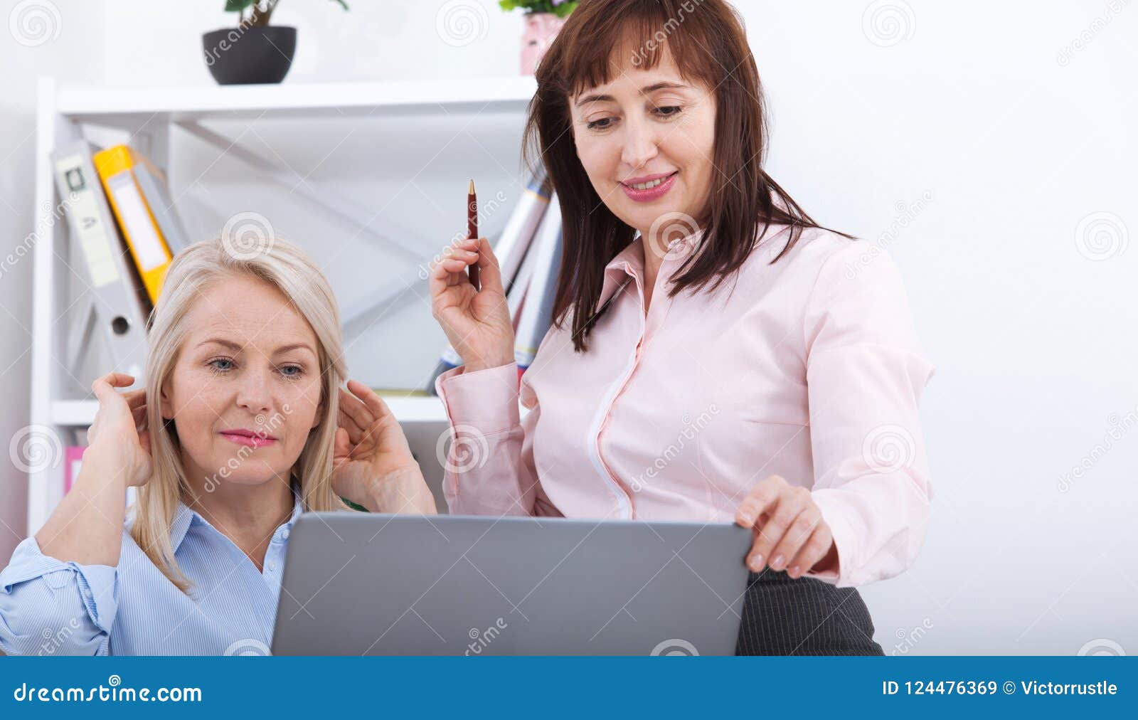 Two Managers Working on Laptop in Office. Stock Image - Image of busy ...