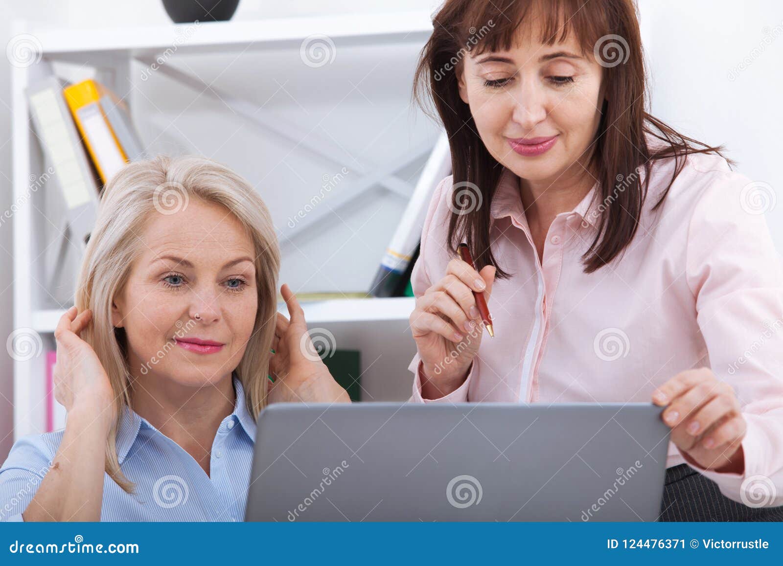 Two Managers Working on Laptop in Office. Stock Image - Image of ...