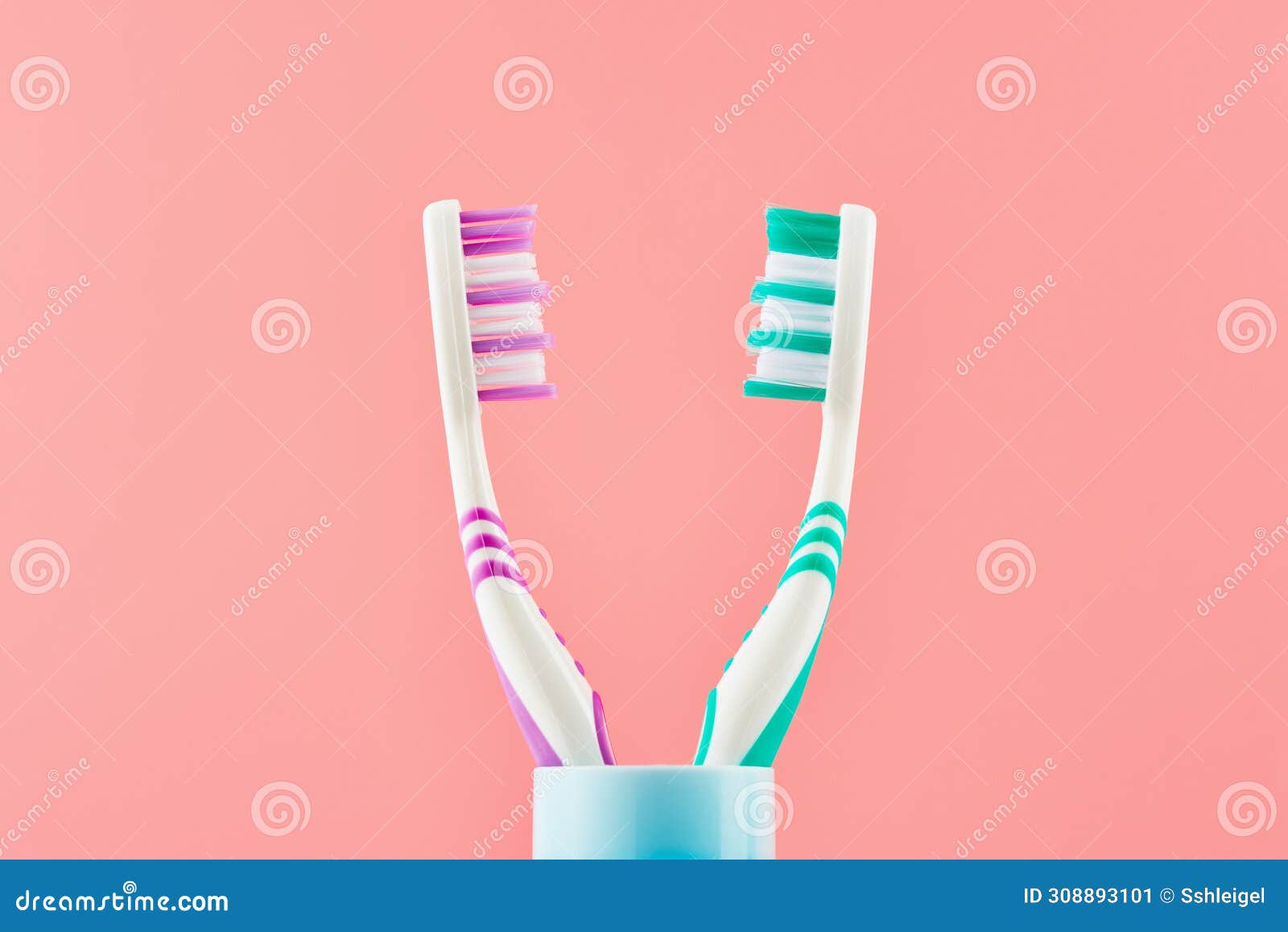Two Manual Toothbrushes on a Pink Background. Front View from Low Angle ...