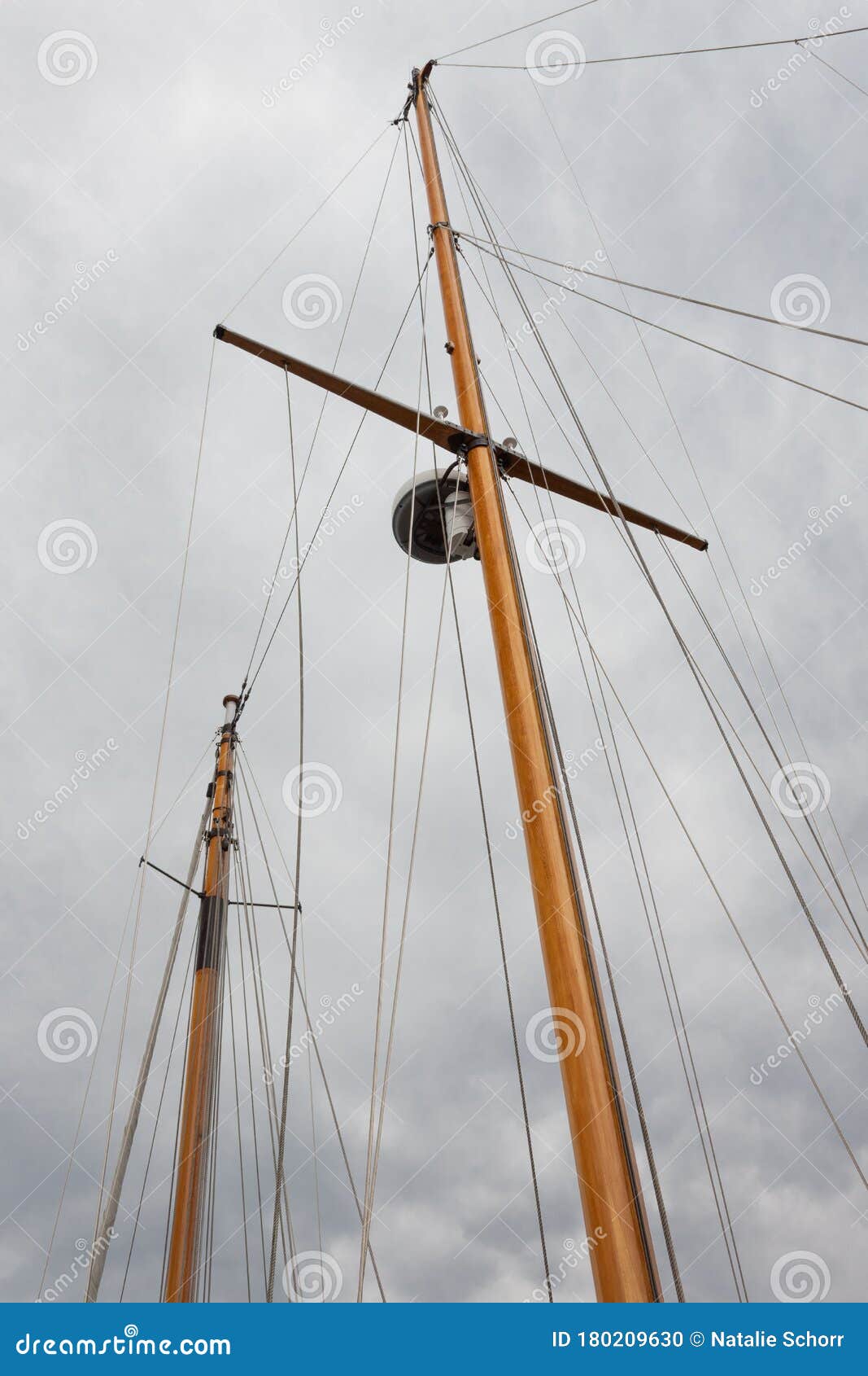 Two Masts from a Large Sailboat Against a Stormy Sky with Clouds Stock ...