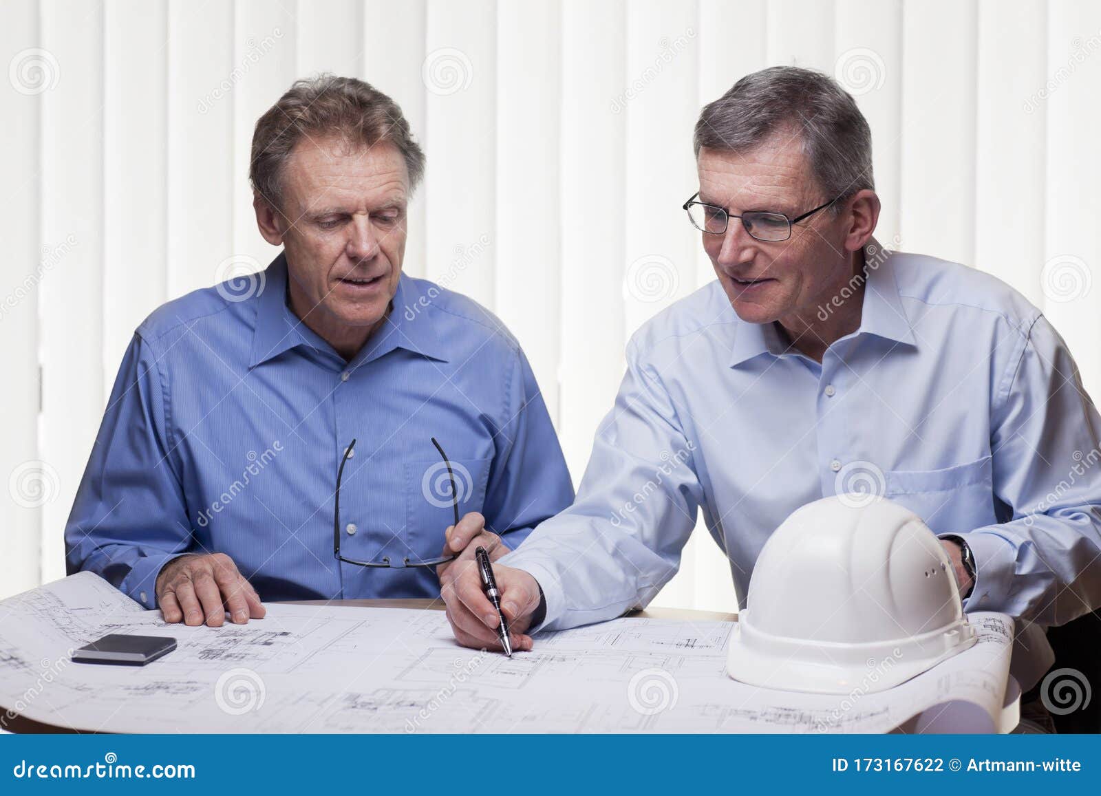 Two Mature Architects or Engineers Discussing a Project Stock Photo ... Two Mature Architects or Engineers Discussing a Project Stock Photo ...