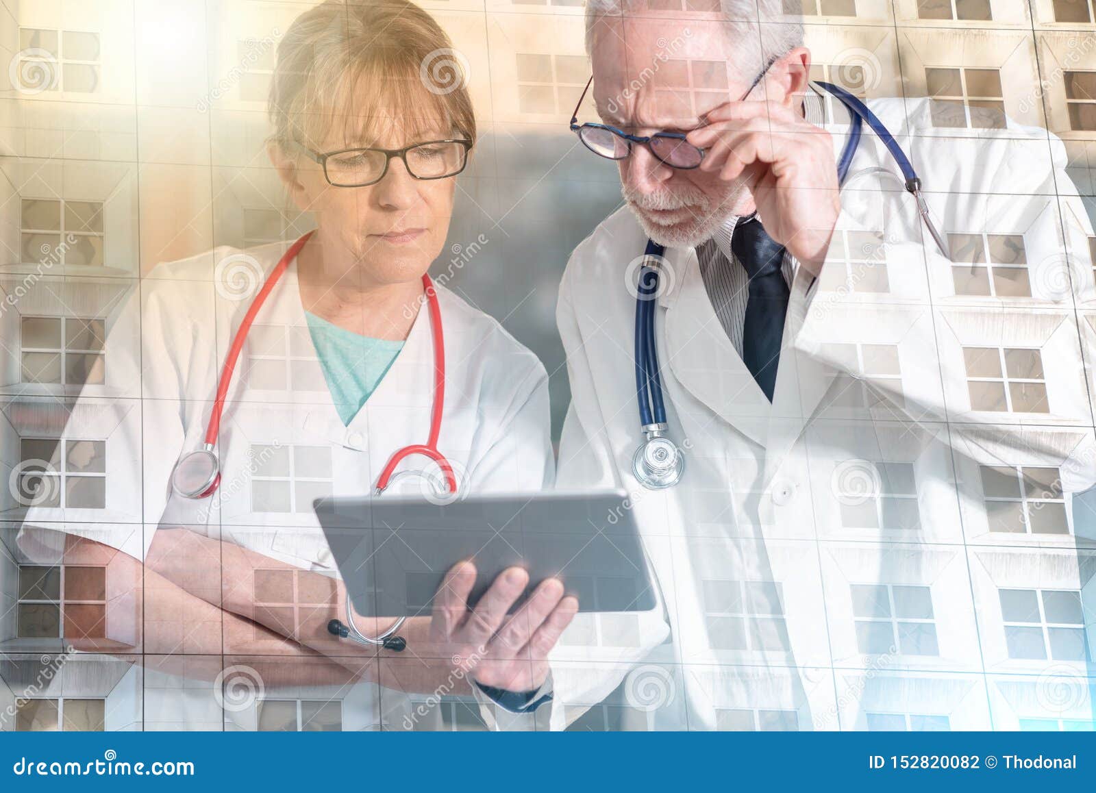 Two Doctors Discussing about Medical Report on Tablet; Multiple ... Two Doctors Discussing about Medical Report on Tablet; Multiple ...