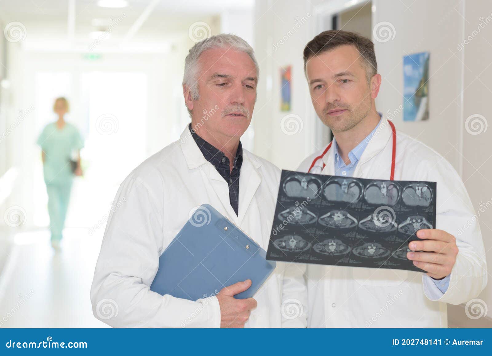 Two Mature Male Radiologist Holding X-ray Stock Image - Image of mature ...