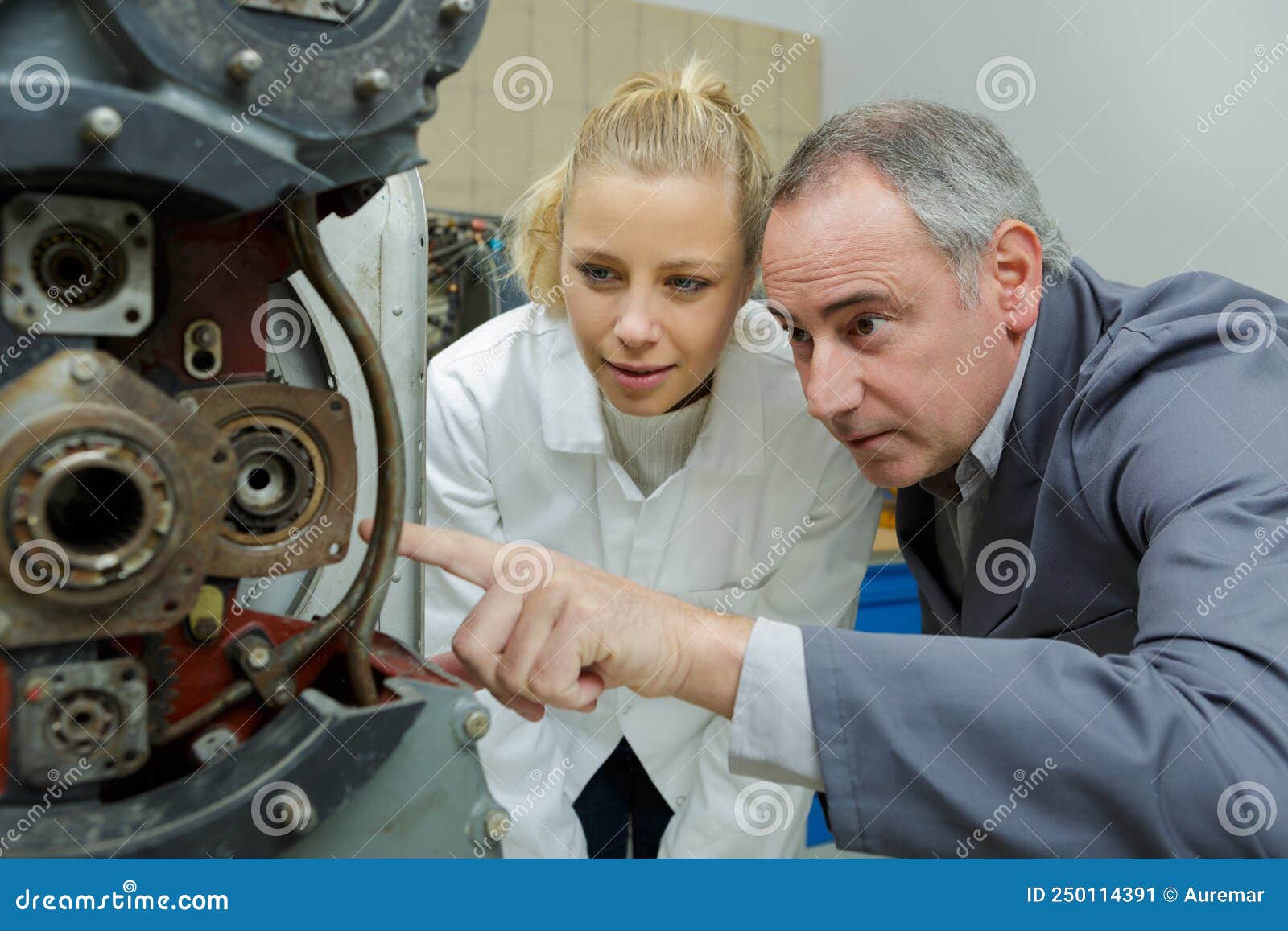 Two Mechanical Engineers at Work Stock Image - Image of woman, robot ...