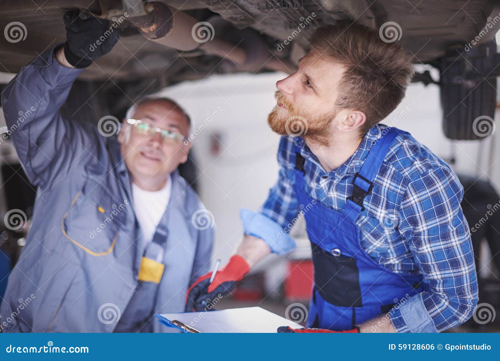 Two mechanics stock photo. Image of cooperation, clipboard - 59128606