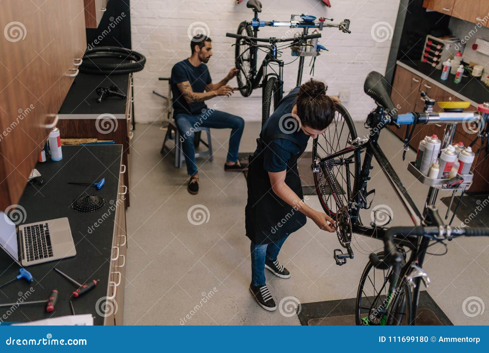 Two Mechanics Repairing Bicycles in Workshop Stock Photo - Image of ...