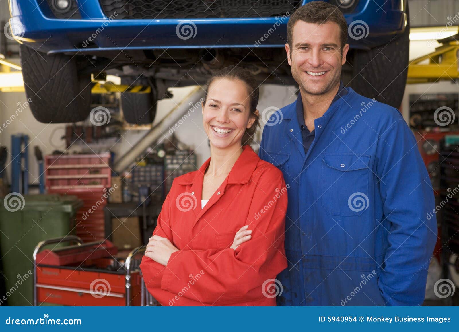 Two Mechanics Standing in Garage Smiling Stock Photo - Image of ...