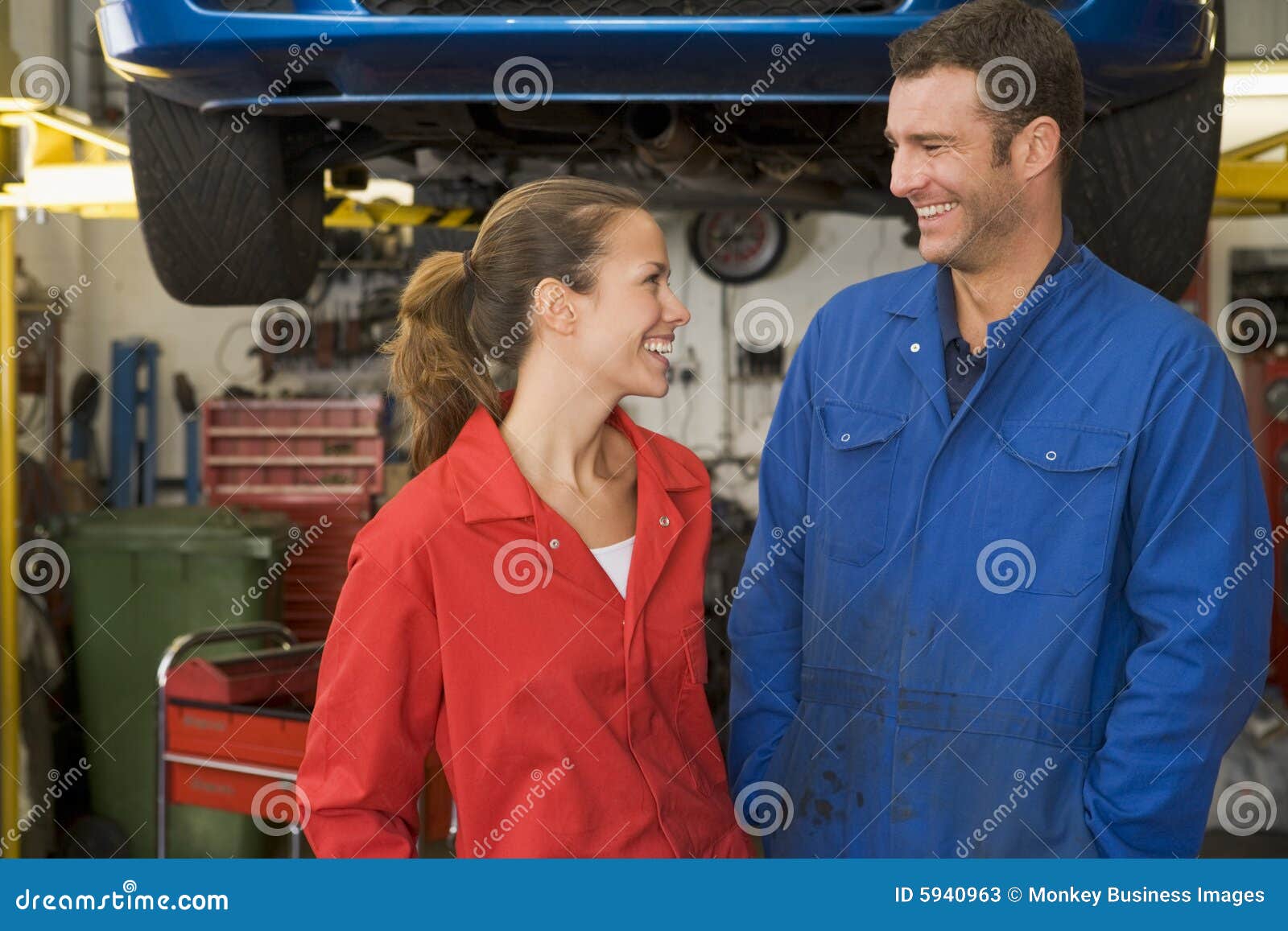 Two Mechanics Standing in Garage Smiling Stock Image - Image of skilled ...
