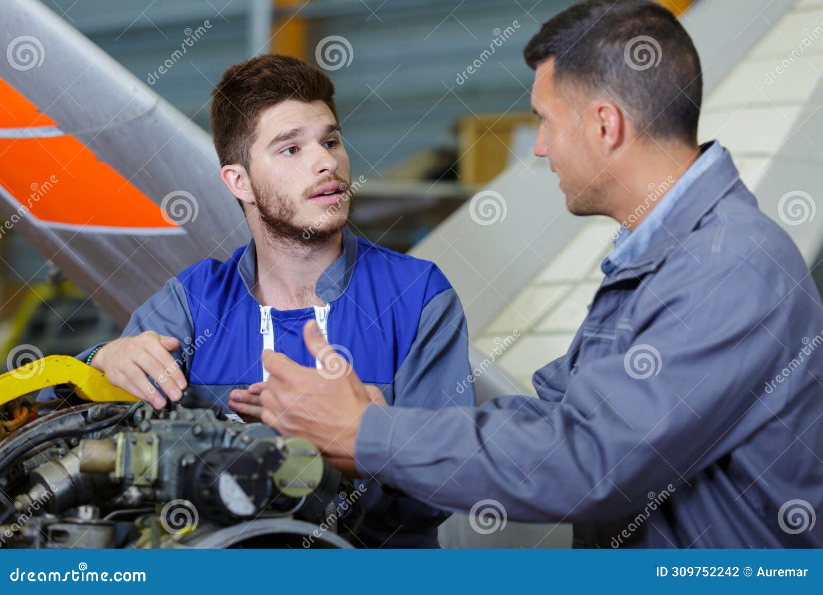 Two Mechanics Taking about Airplane Stock Photo - Image of aeroplane ...