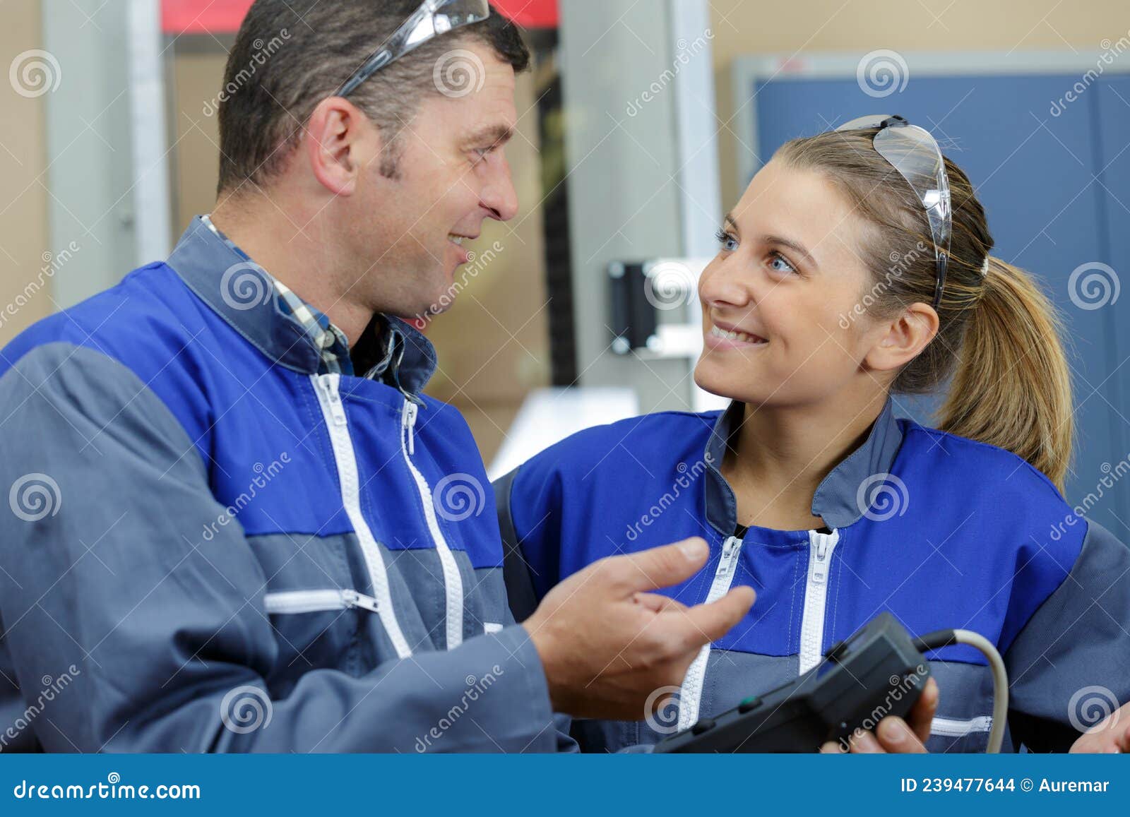 Two Mechanics Talking and Laughing Stock Photo - Image of technology ...