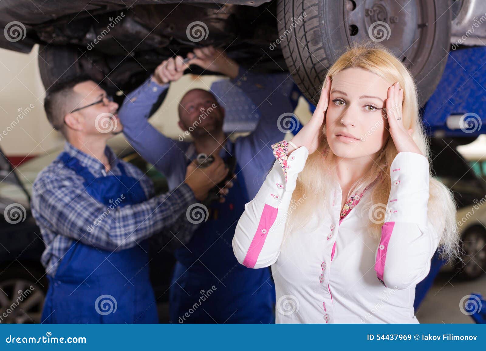 Two Mechanics Trying To Cheat Client at Workshop Stock Image - Image of ...