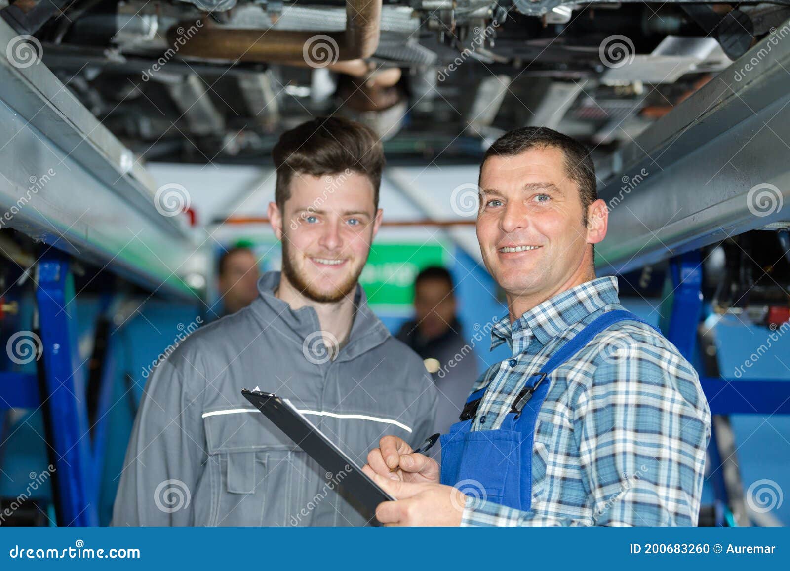 Two Mechanics Working on Car Stock Photo - Image of mechanics ...