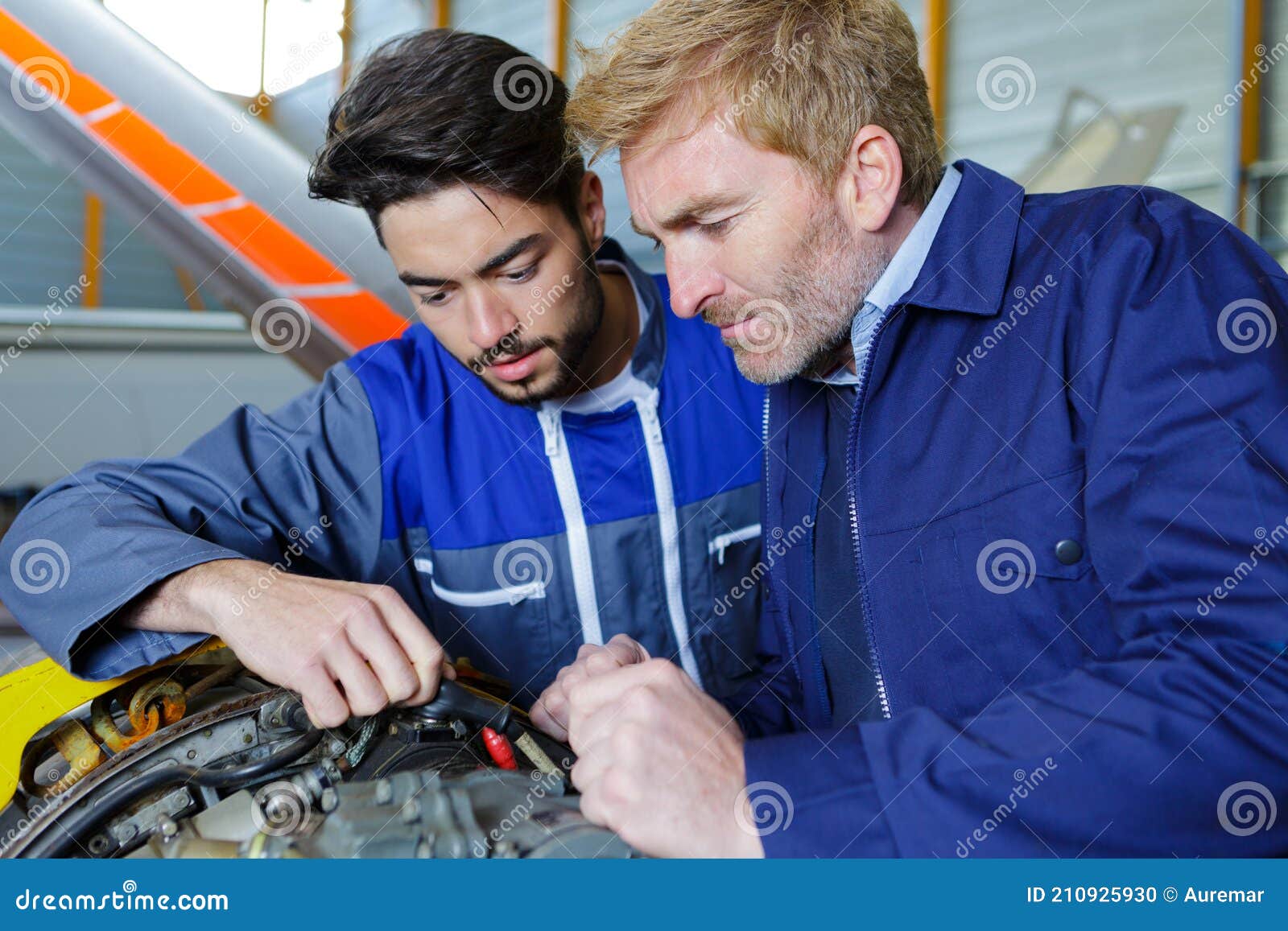 Two Mechanics Working on Car Stock Photo - Image of dialogue, vehicle ...