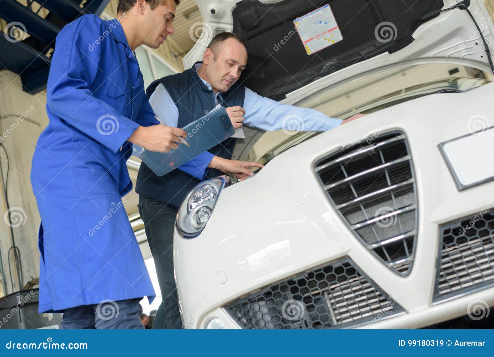 Two Mechanics Working on Car Stock Image - Image of examine, toned ...