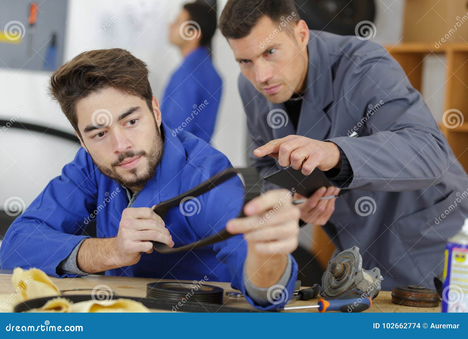 Two Mechanics Working on Car Part Stock Photo - Image of transport ...