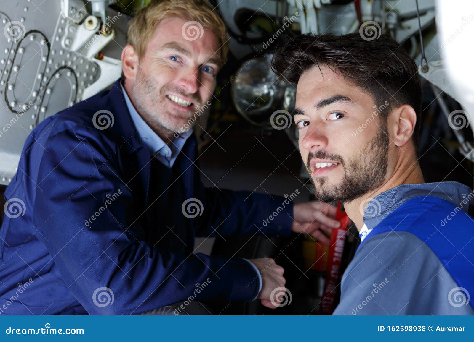 Two Mechanics Working in Repair Shop Stock Photo - Image of operate ...