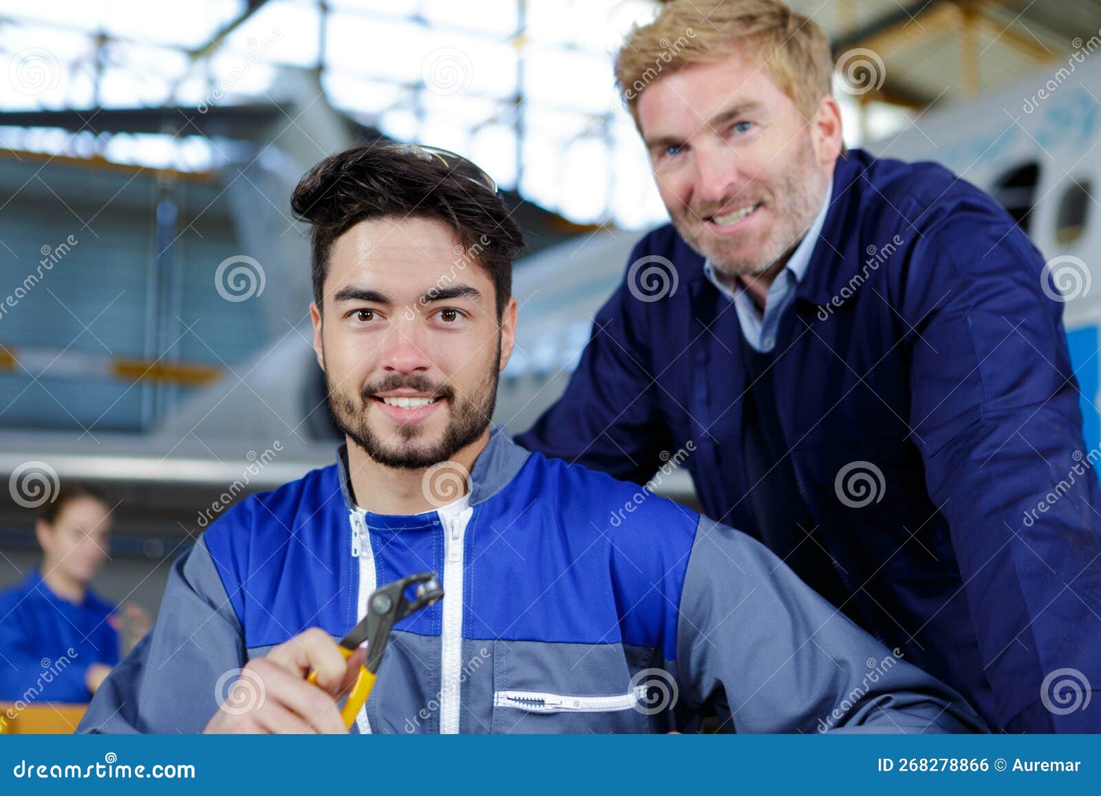 Two Mechanics Working on Aircraft in Hangar Stock Photo - Image of team ...