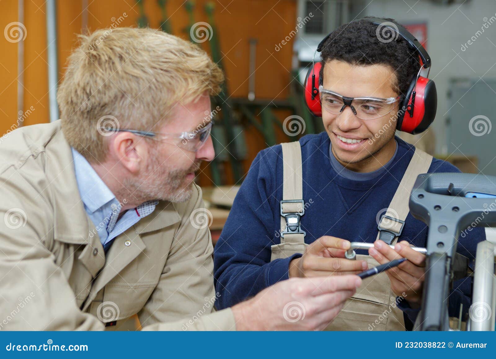Two Mechanics Working on Something Stock Photo - Image of industry ...