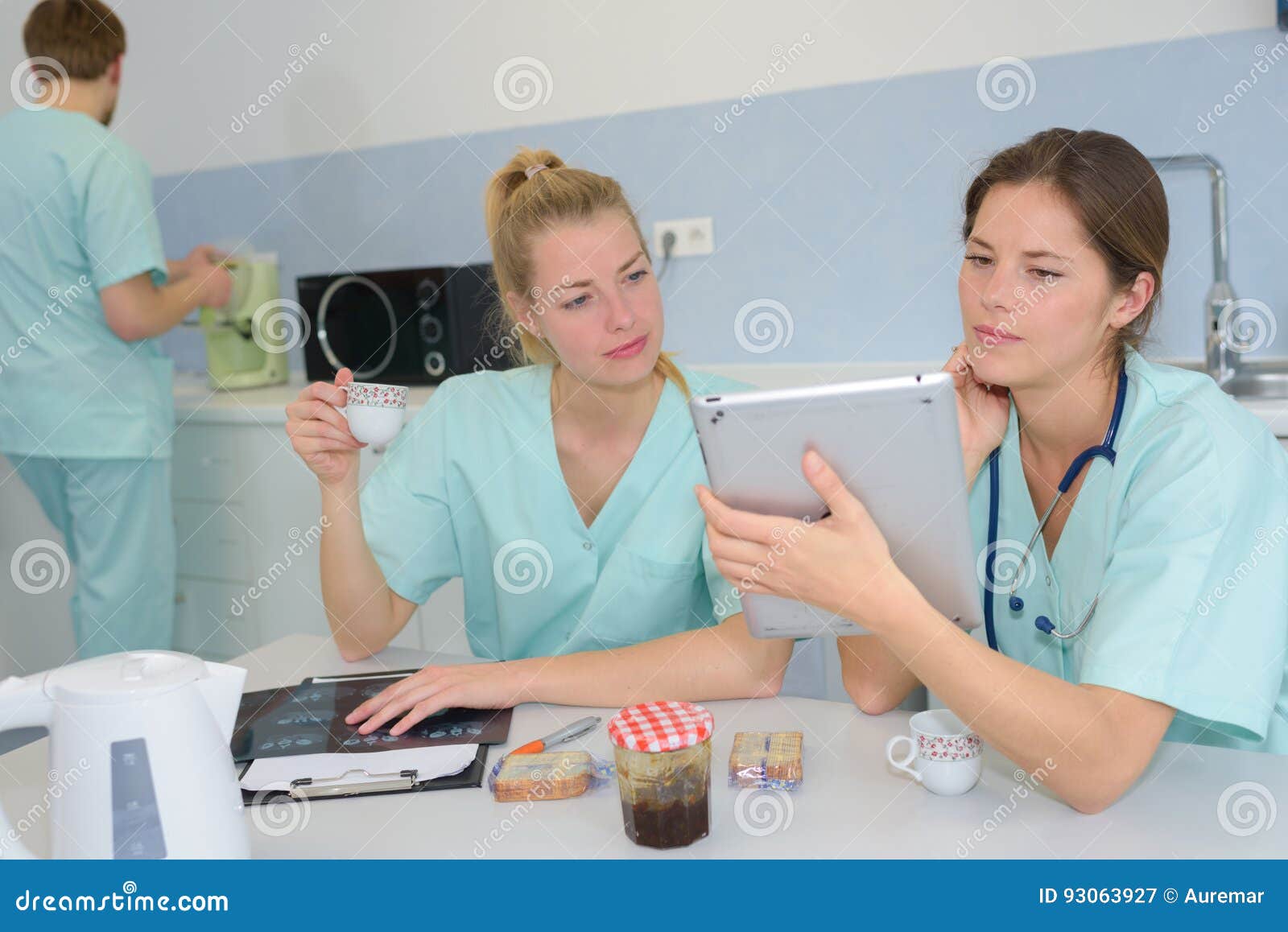 Two Medical Coworkers Looking at Tablet Stock Image - Image of adult ...