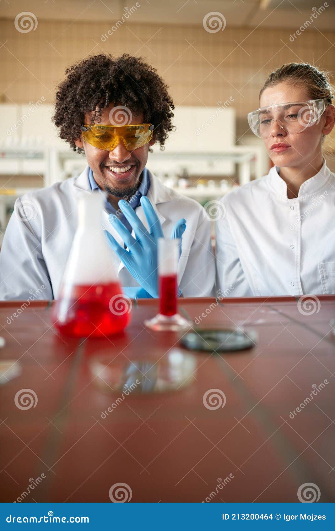 Two Medical Students Conducting Chemical Experiment Stock Photo - Image ...