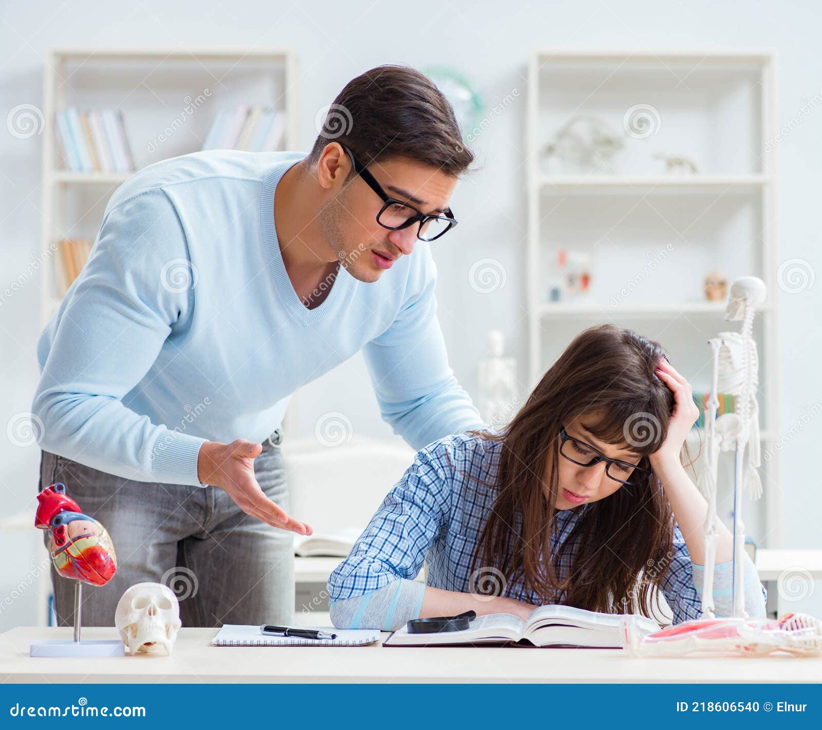 Two Medical Students Studying in Classroom Stock Photo - Image of book ...