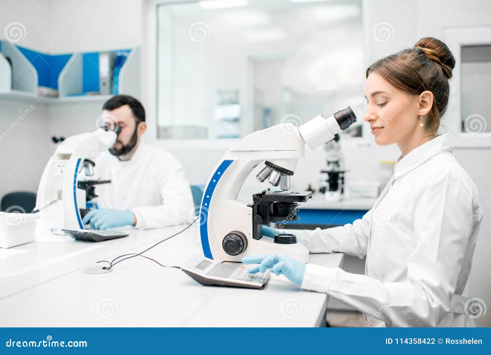 Medics Working with Microscope at the Laboratory Stock Photo - Image of ...