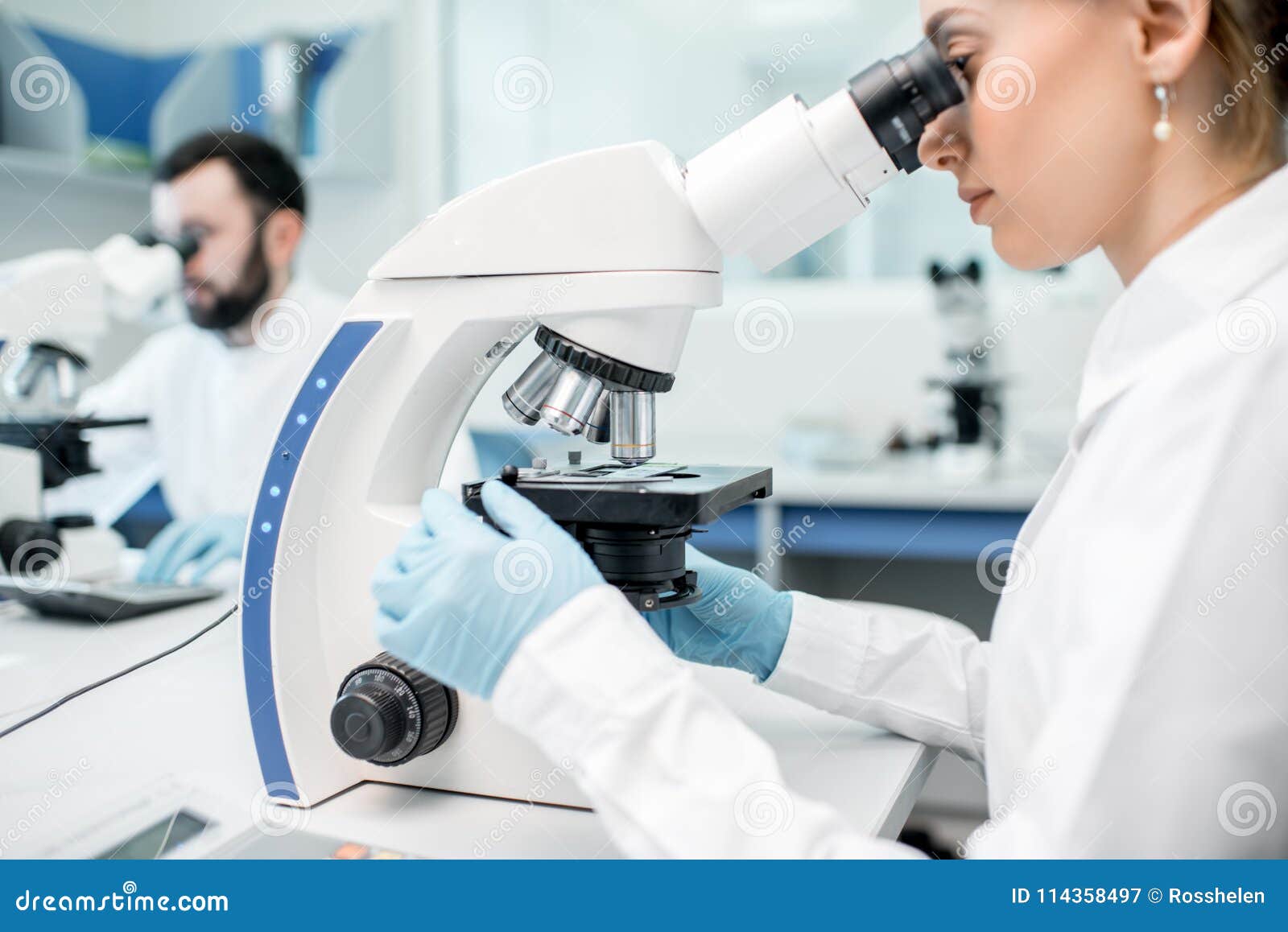 Medics Working with Microscope at the Laboratory Stock Image - Image of ...