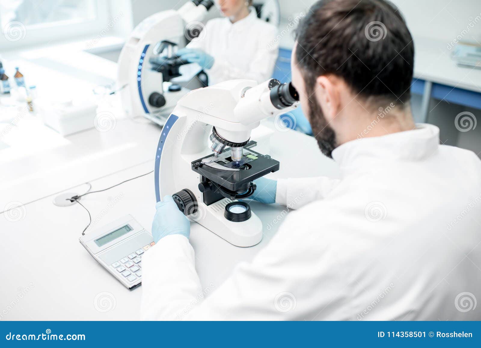 Medics Working with Microscope at the Laboratory Stock Image - Image of ...