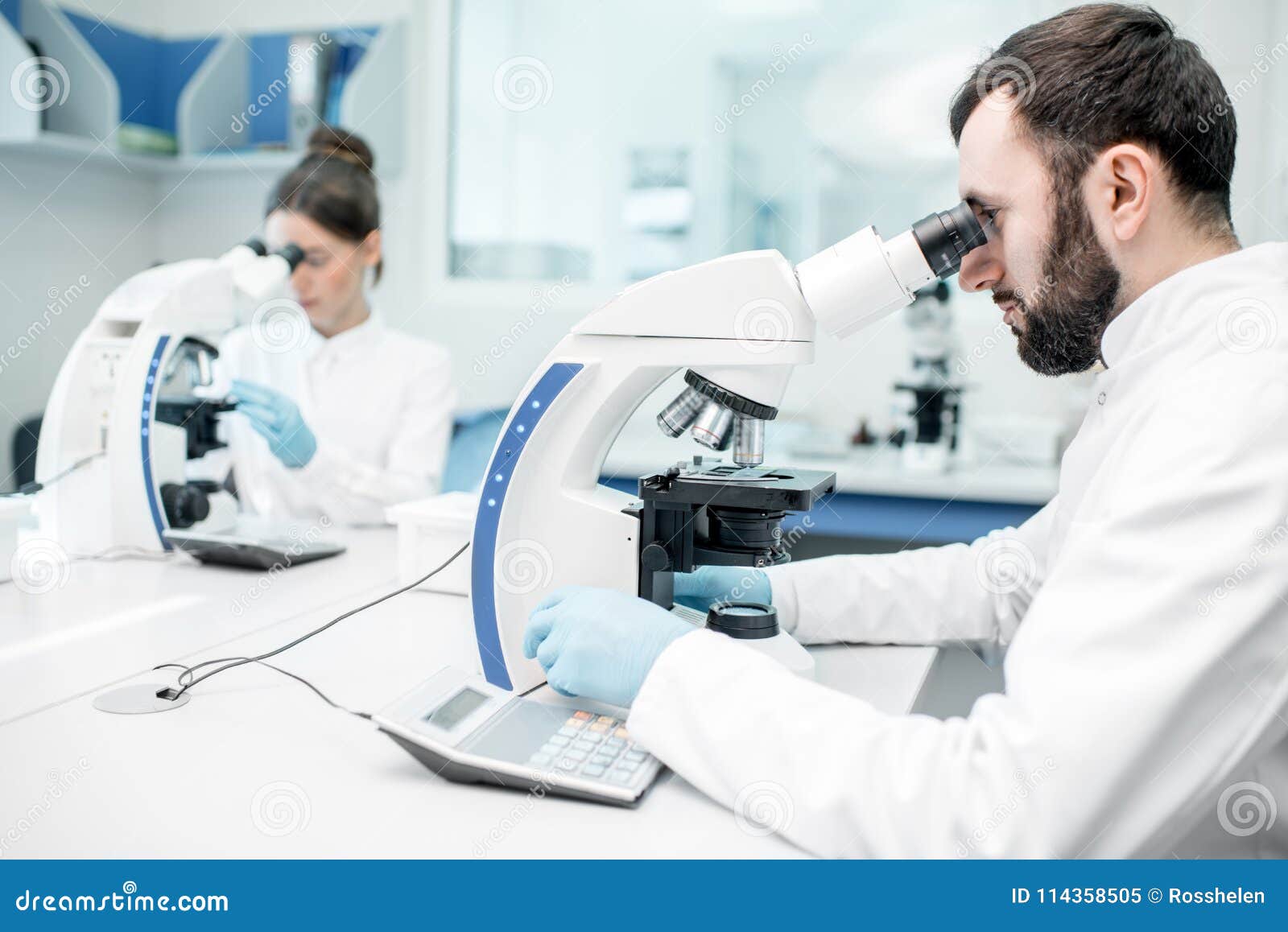 Medics Working with Microscope at the Laboratory Stock Image - Image of ...