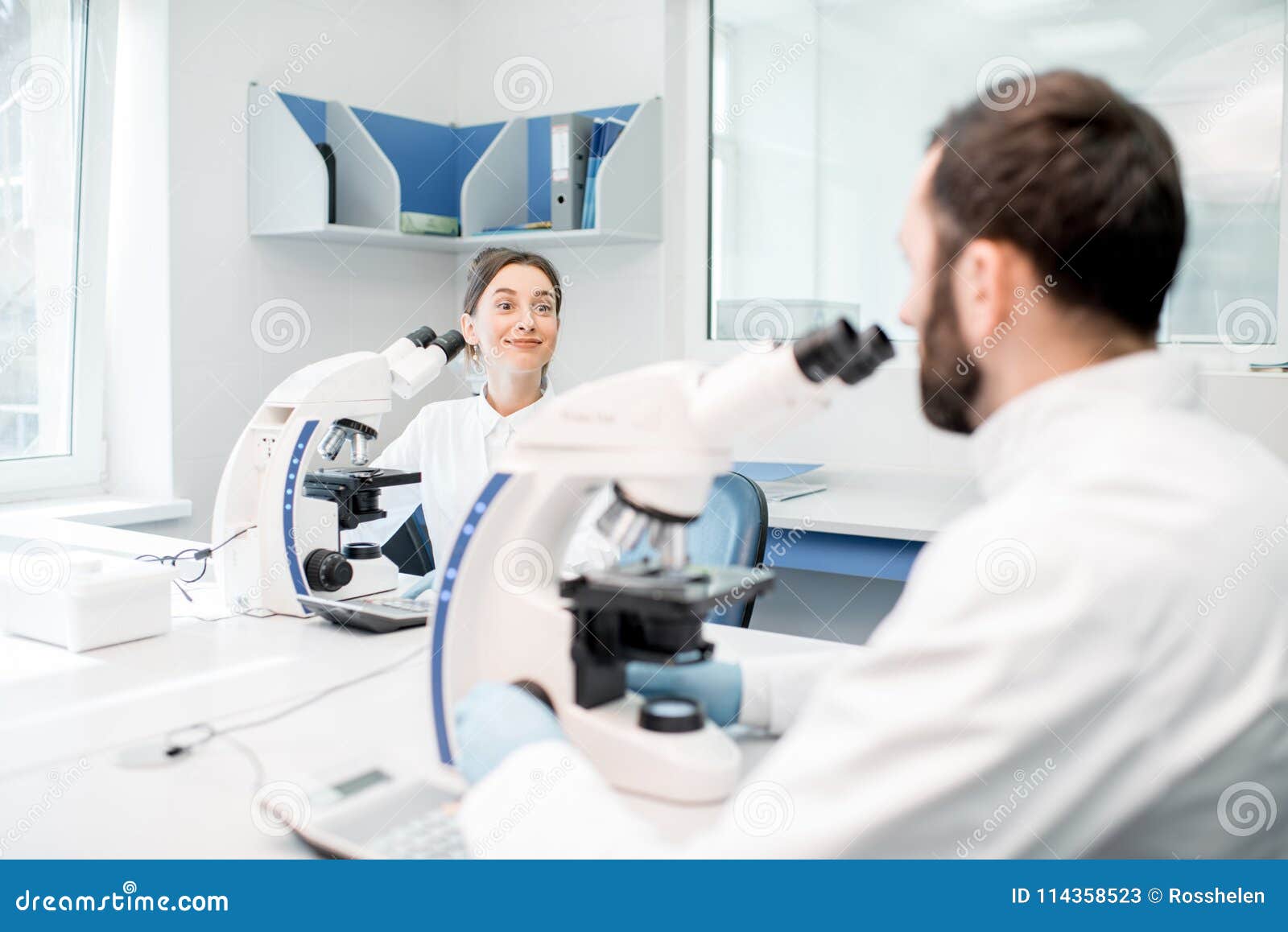 Medics Working with Microscope at the Laboratory Stock Image - Image of ...