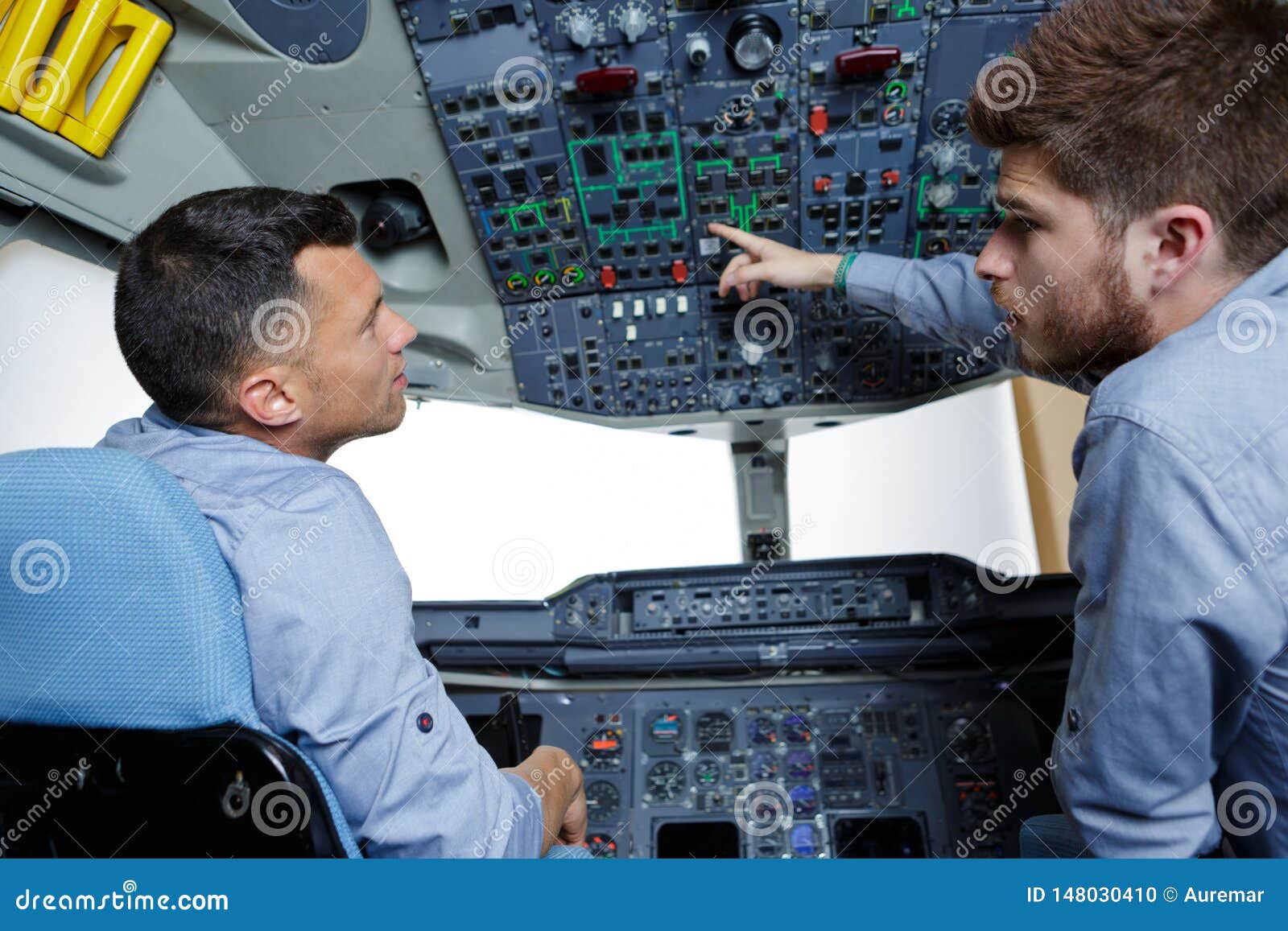 Two Men in Aircraft Cockpit Apprentice Asking Question Stock Photo ...