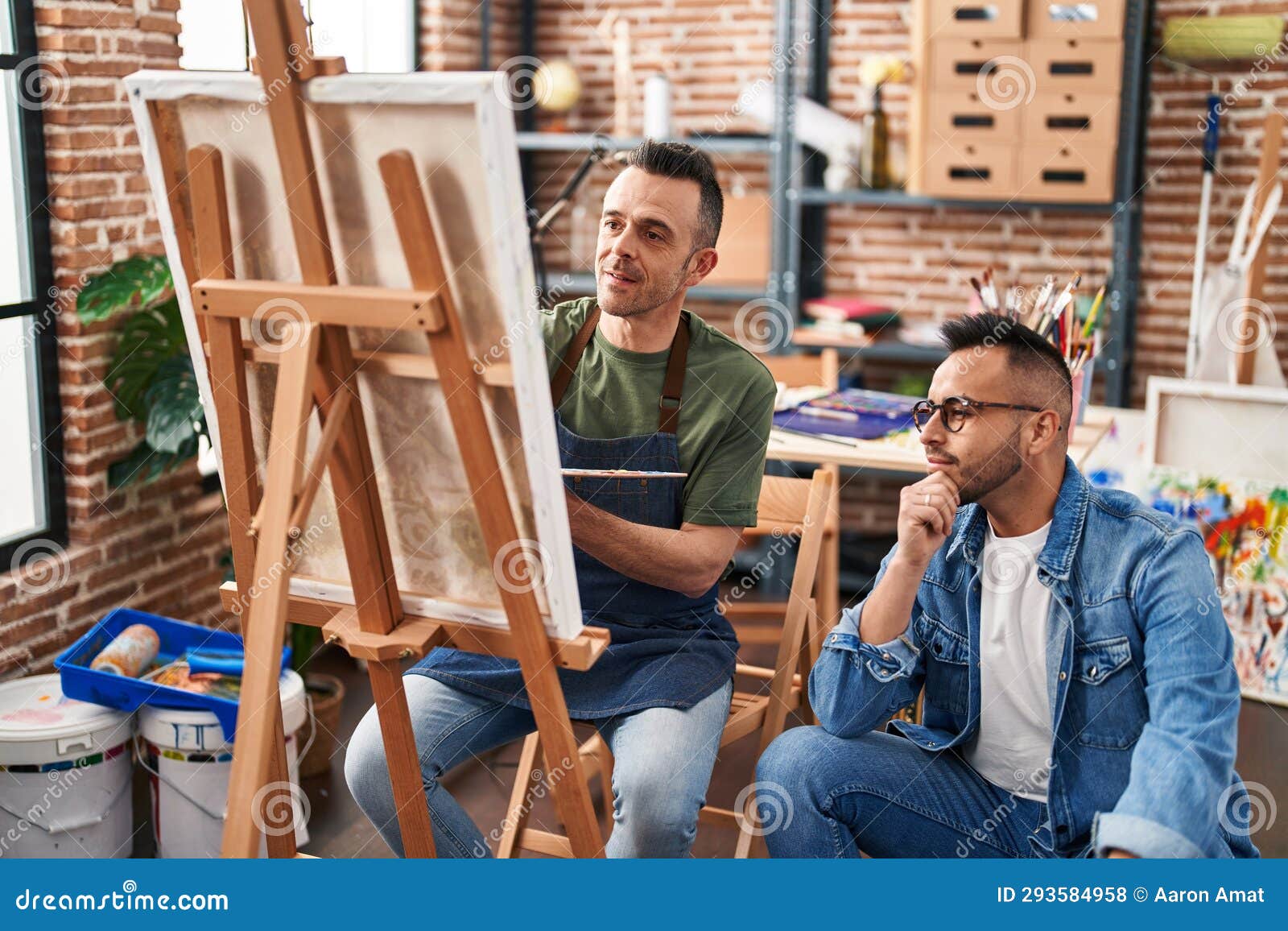 Two Men Artists Drawing with Relaxed Expression at Art Studio Stock ...