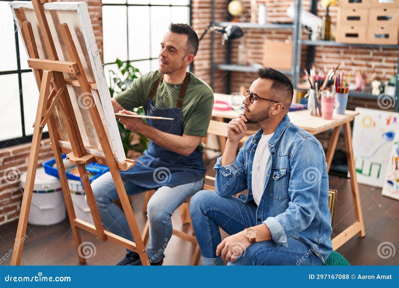 Two Men Artists Drawing with Relaxed Expression at Art Studio Stock ...