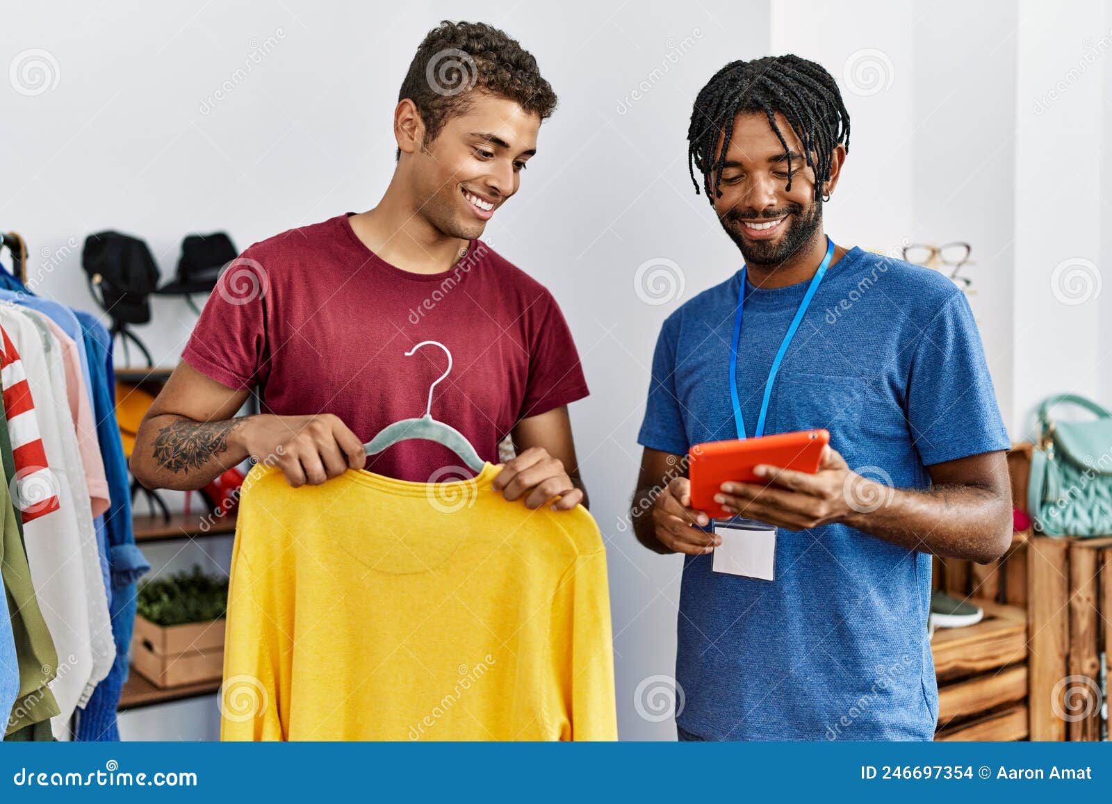 Two Men Asking Shopkeeper for Clothes Size Using Touchpad at Clothing ...