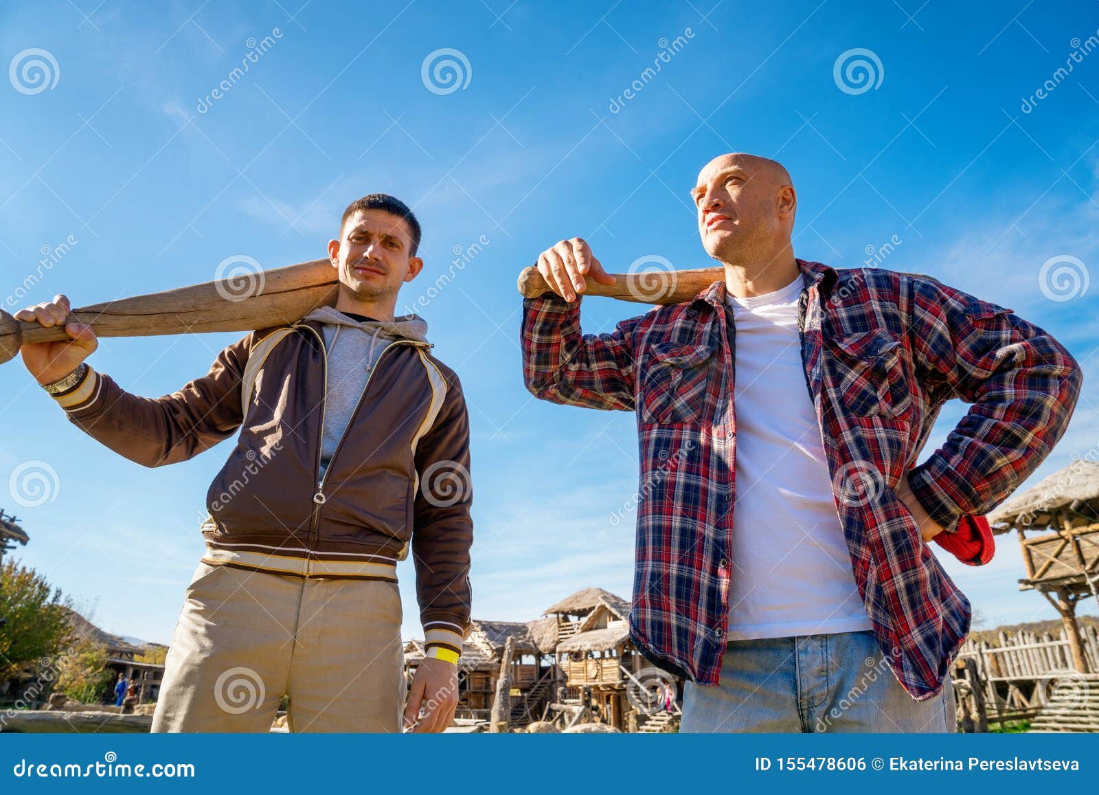 Two Men with Bats in Nature Stock Photo - Image of bandit, muscle ...
