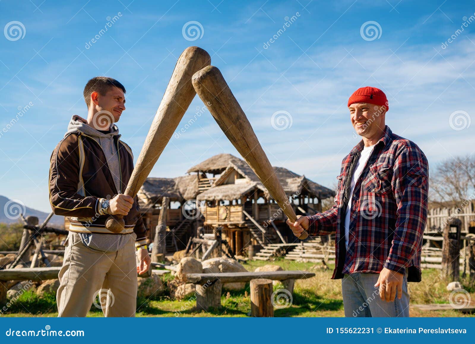 Two Men with Bats in Nature Stock Image - Image of packs, jeans: 155622231
