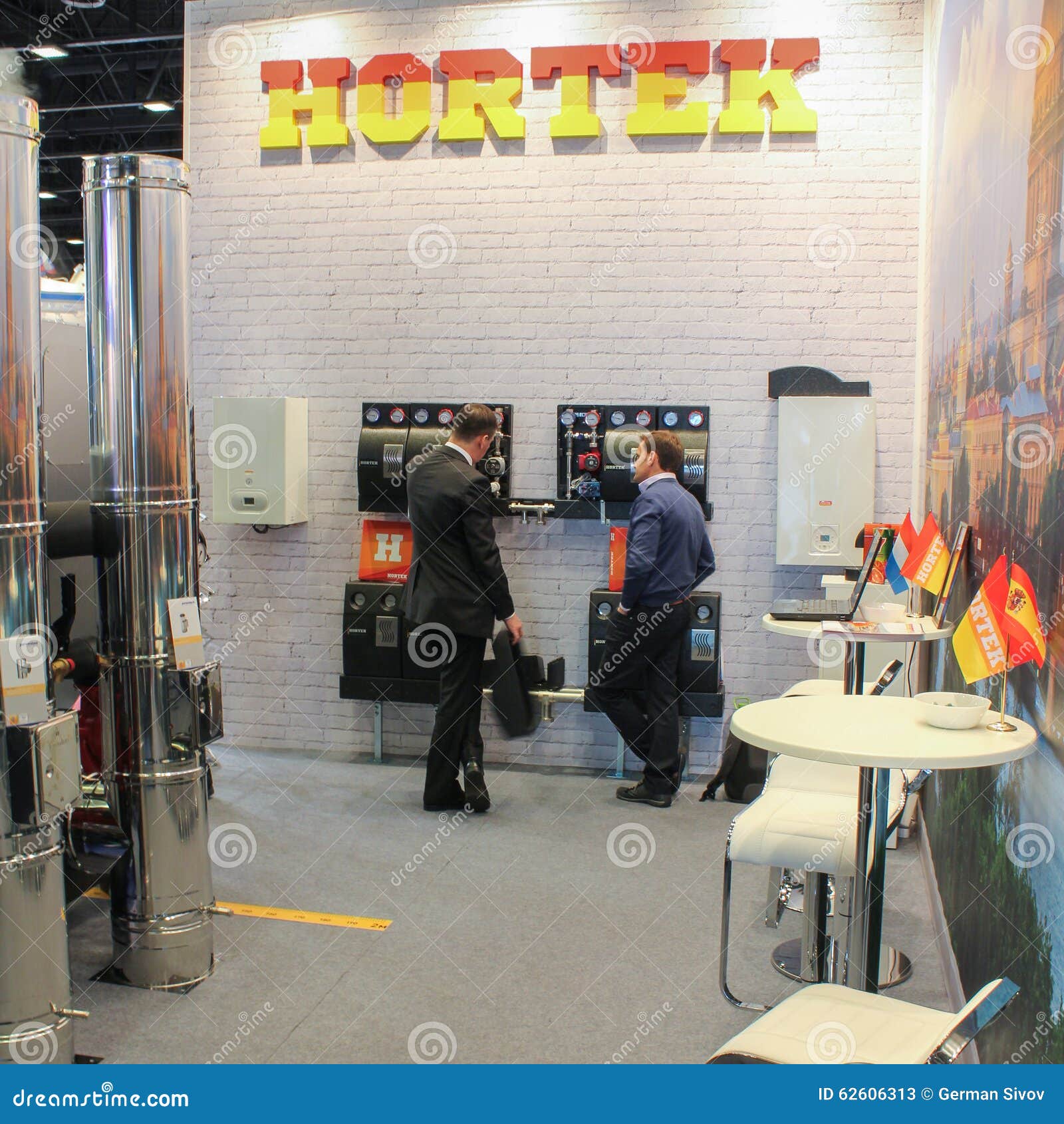 Two men at the booth. editorial stock photo. Image of industry - 62606313