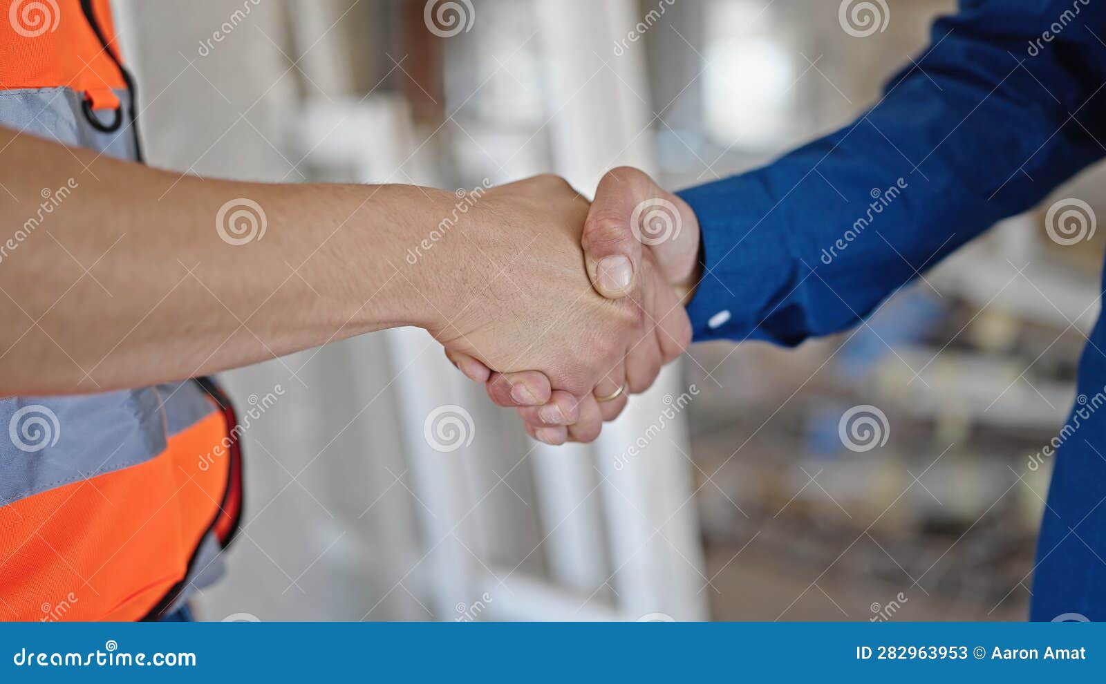 Two Men Builder and Architect Shake Hands at Construction Site Stock ...