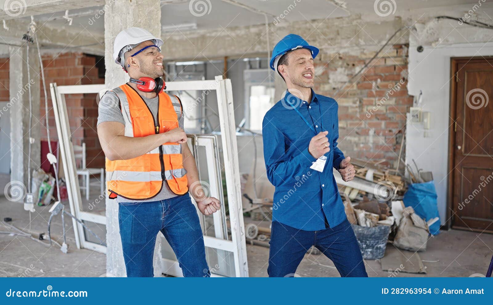 Two Men Builder and Architect Smiling Confident Dancing at Construction ...