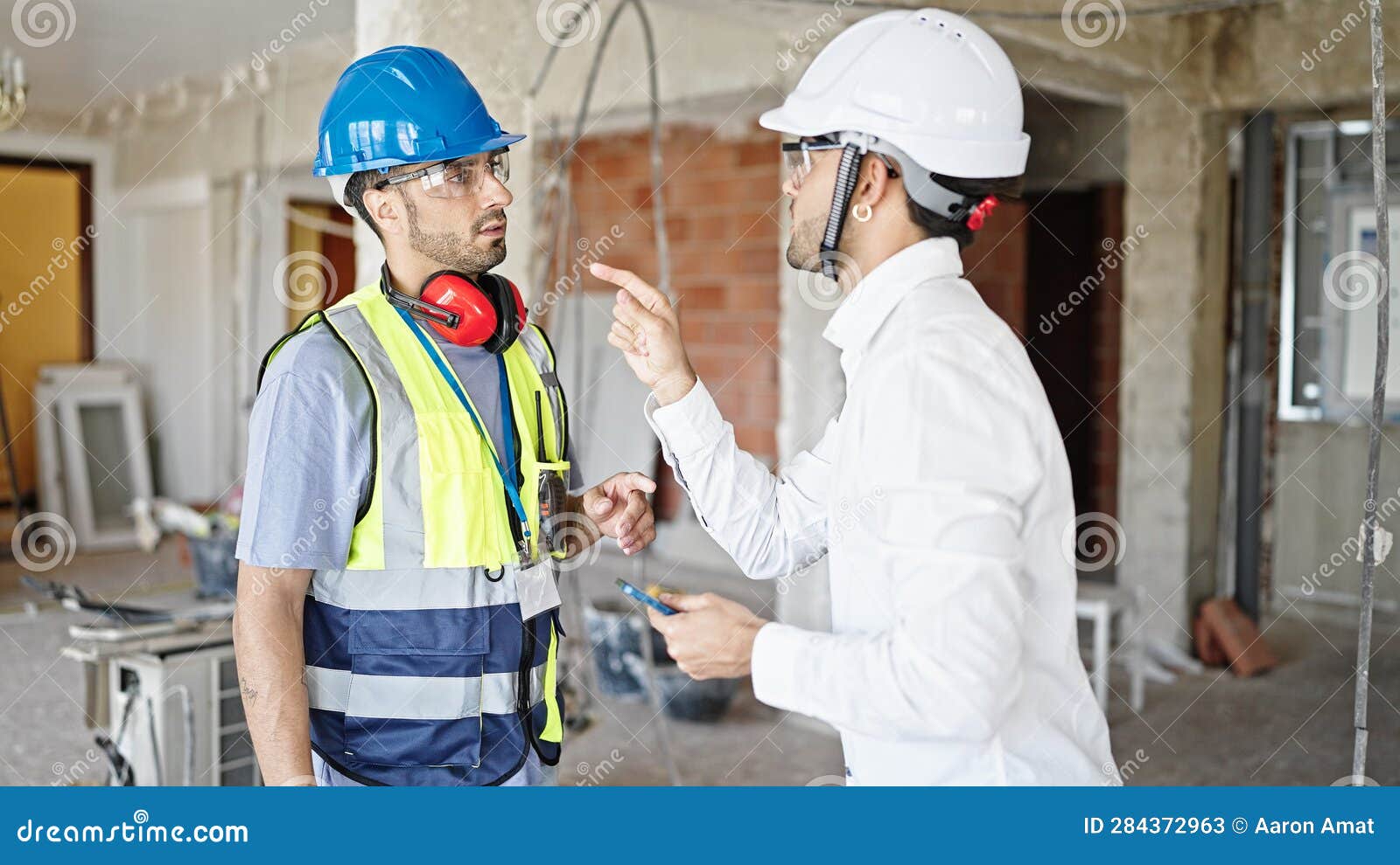 Two Men Builder and Architect Standing Together Speaking at ...