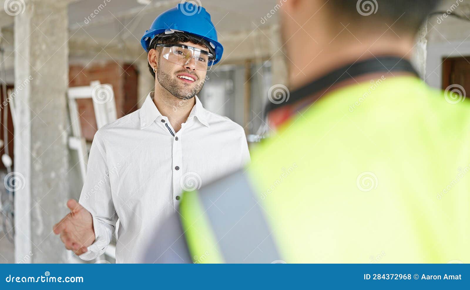 Two Men Builder and Architect Standing Together Speaking at ...