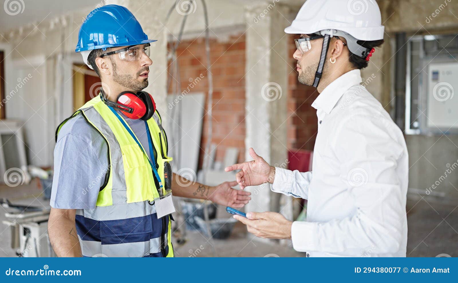 Two Men Builder and Architect Standing Together Speaking at ...