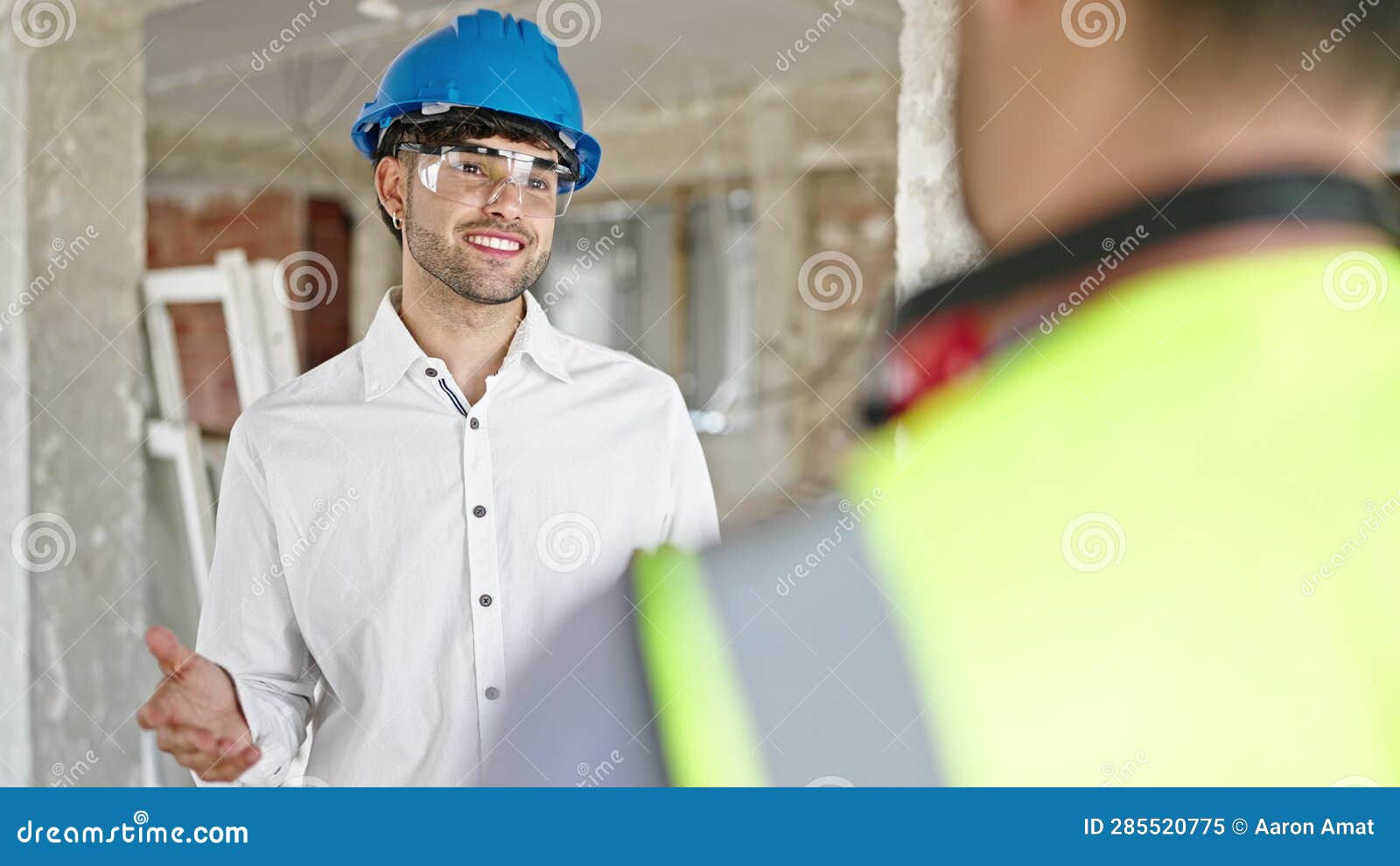 Two Men Builder and Architect Standing Together Speaking at ...