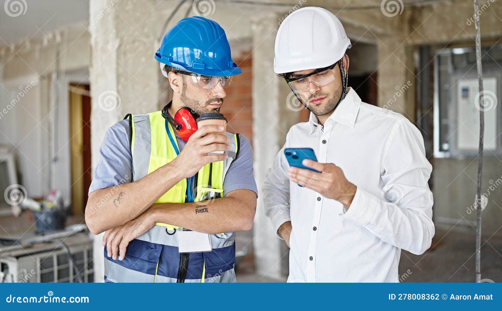 Two Men Builders and Architect Using Smartphone Drinking Coffee at ...