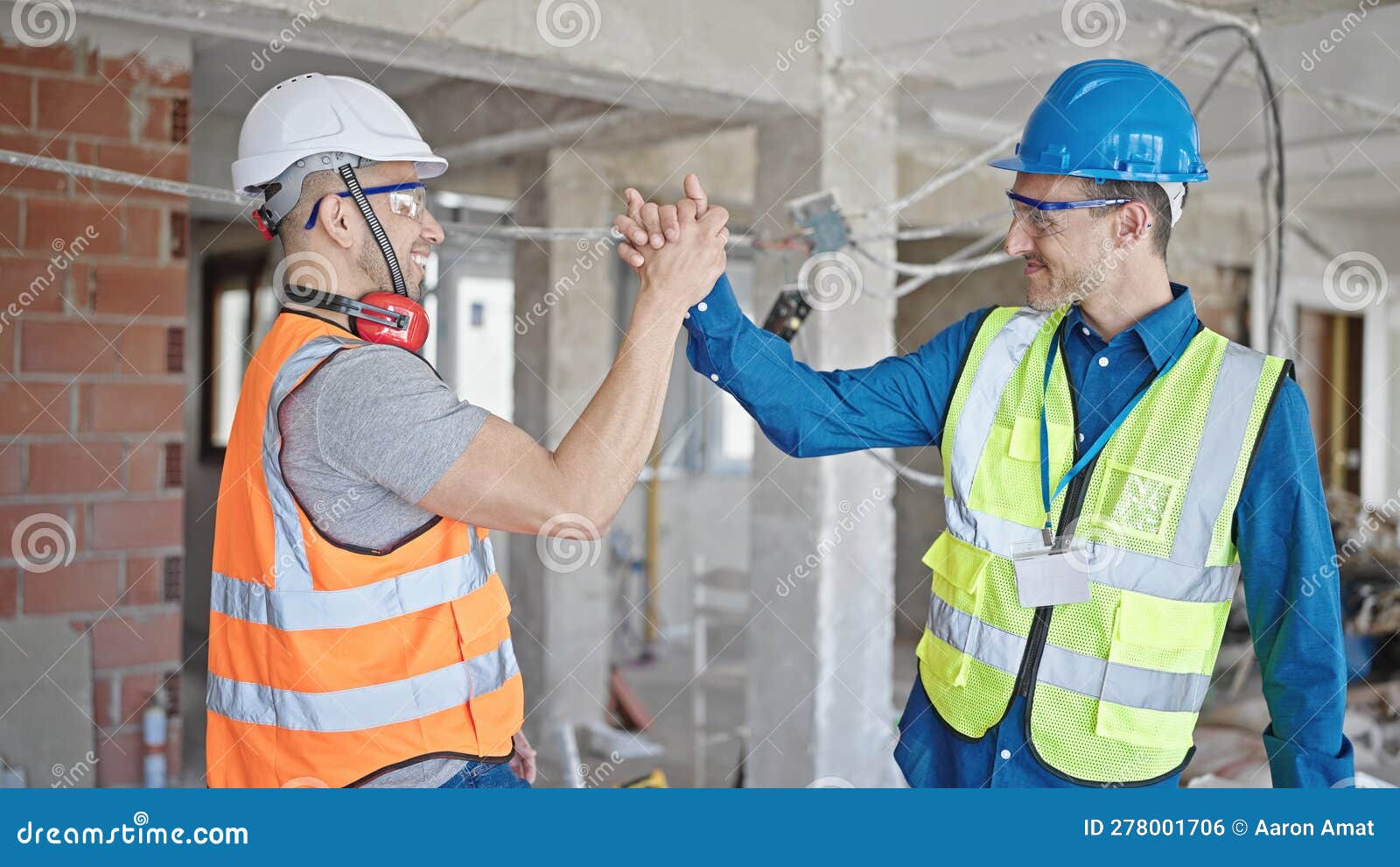 Two Men Builders Shake Hands Speaking at Construction Site Stock Photo ...
