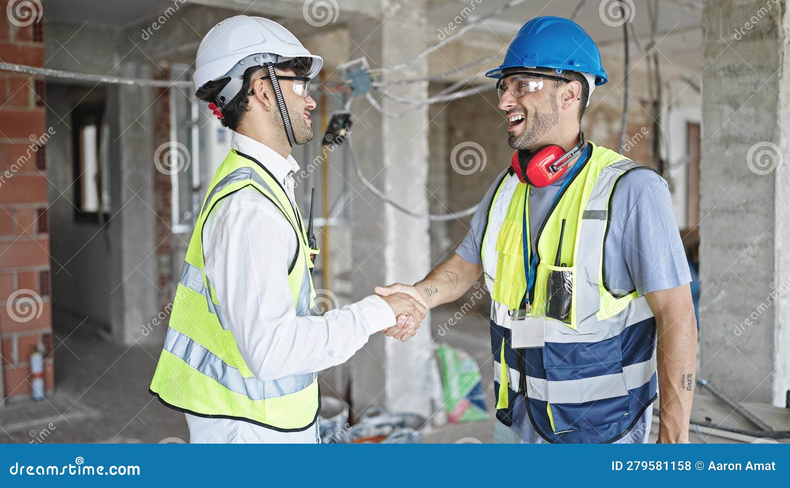 Two Men Builders Smiling Confident Shake Hands at Construction Site ...