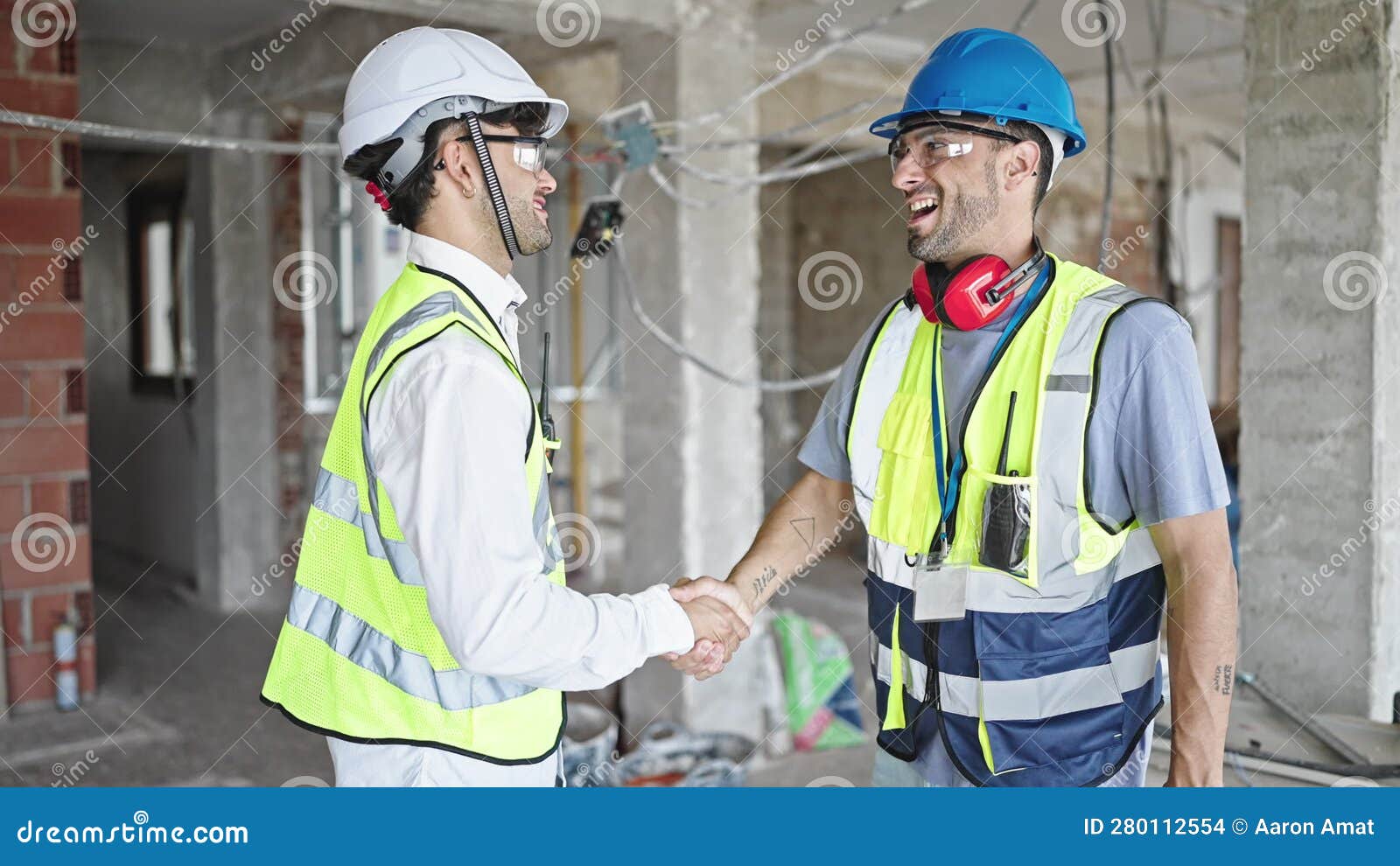 Two Men Builders Smiling Confident Shake Hands at Construction Site ...