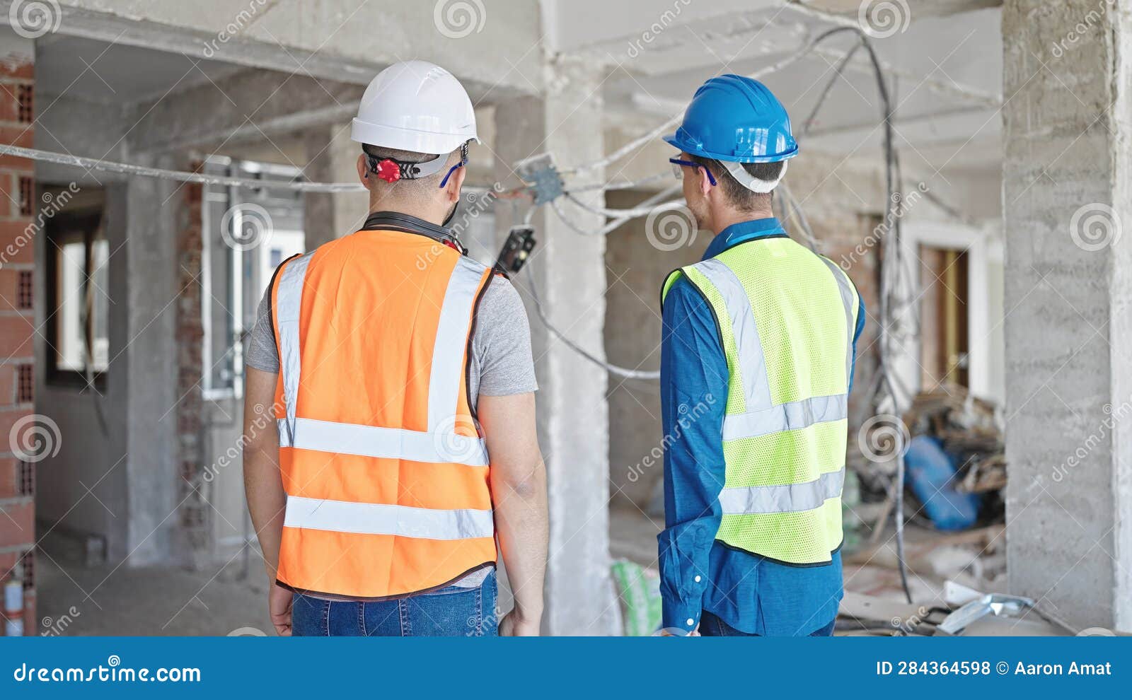 Two Men Builders Standing Together Backwards at Construction Site Stock ...